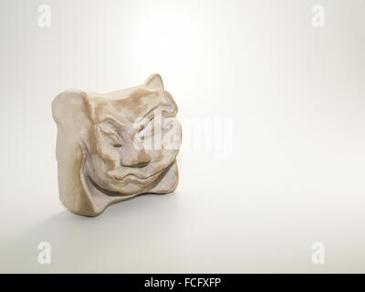 Clay sculpture of angry sleeping scrunched up face on white background ...