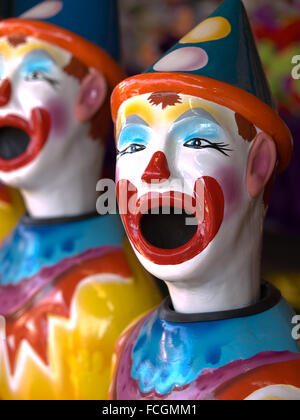 Line of ceramic clown head with open mouths at a game at the Canadian ...