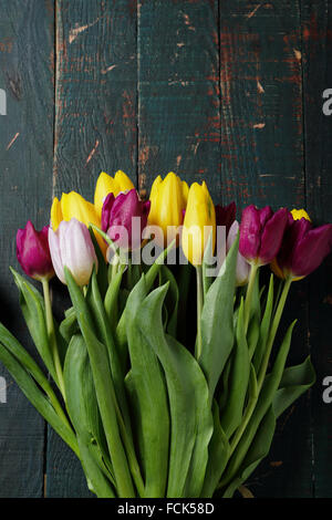 Tulips flowers bouquet of wooden boards as a background Stock Photo - Alamy