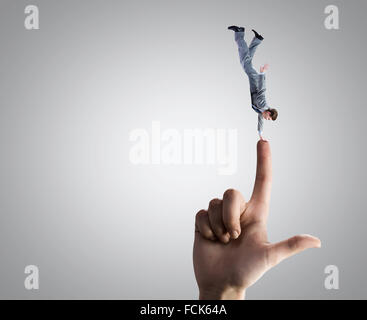 Big human hand catching businessman. Professional relations Stock Photo ...