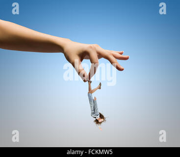 Giant human hand holding miniature of businesswoman Stock Photo - Alamy