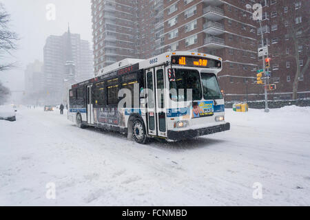 A New York City bus with chains on its tires for traction in the snow ...