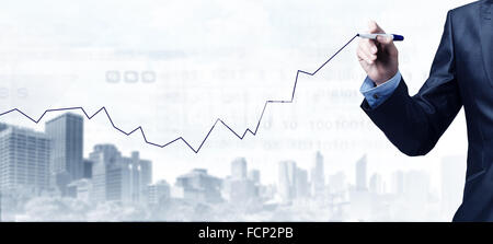 Close up of businessman drawing increasing graph with marker Stock ...