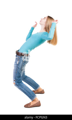 Balancing young woman. or dodge falling woman. Rear view people ...