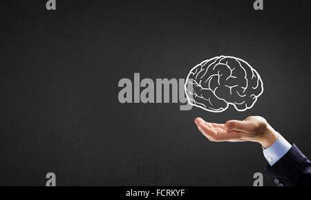Brain in hand or save intelligence concept Stock Photo - Alamy