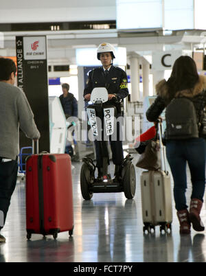 Tokyo, Japan. 25th Jan, 2016. A police officer rides a Segway, a two ...