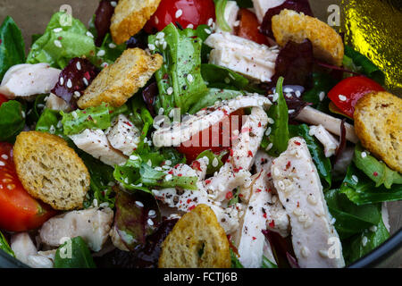 Caesar salad with chicken, tomato and sesam seeds Stock Photo - Alamy