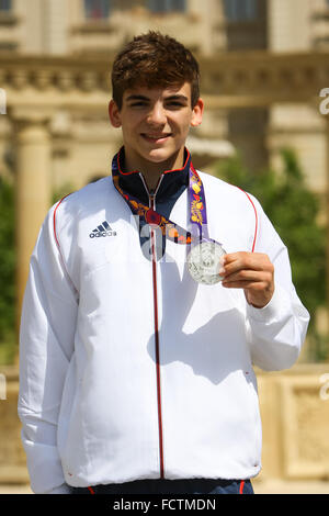 Ross Haslam (GBR) poses with his medal. Athletes Village Main Square ...