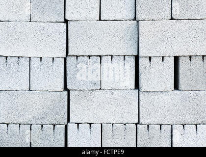 Grey concrete blocks on the pallet for construction. Background and ...
