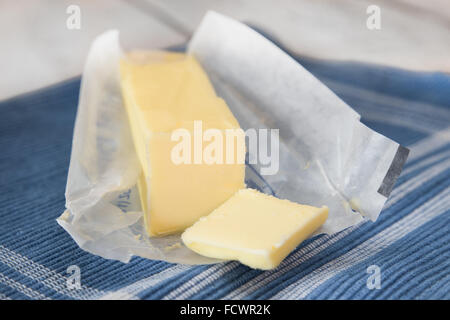stick of fresh creamery butter in opened wrapper Stock Photo - Alamy