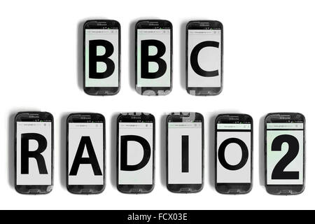 BBC Radio2 written on the screens of smartphone photographed against a ...