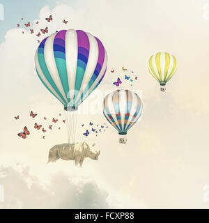 Sunny image of giraffe flying high in sky on aerostat Stock Photo - Alamy