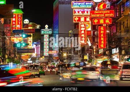 Yaowarat Road in Chinatown, neon signs at night, people and cars, commercial street, billboards ...