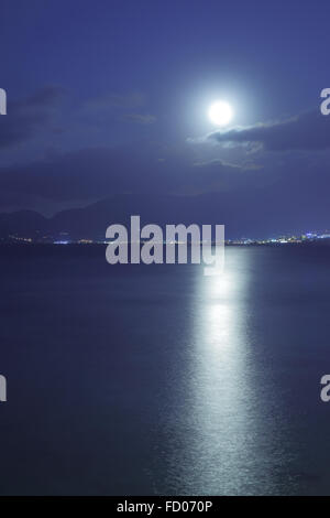 Full moon over the island of Crete at sunset, Mirabello Bay, Crete ...
