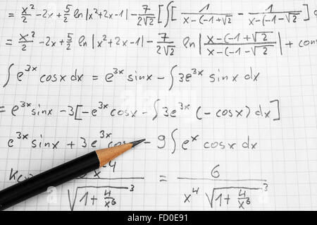 Maths concept - pencil over a sheet of paper with maths-formulas Stock ...