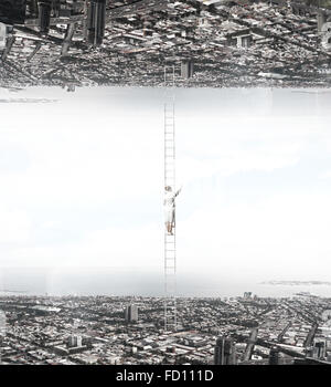 Businesswoman standing on ladder between two realities Stock Photo - Alamy