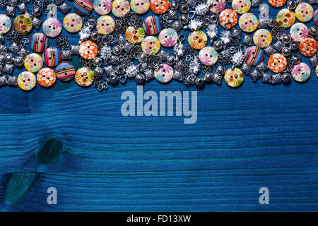 Retro sewing accessories on blue wooden background Stock Photo - Alamy