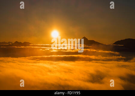 Sunrise on Jochberg mountain with cloud cover, Hirschhörnlkopf in front ...