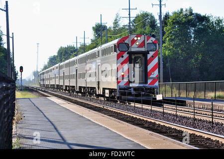 Chicago, Illinois, USA. An inbound Metra commuter train arriving along electrified trackage ...