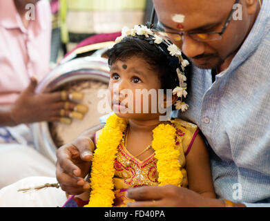 Traditional Indian Hindus ear piercing ceremony Stock Photo - Alamy