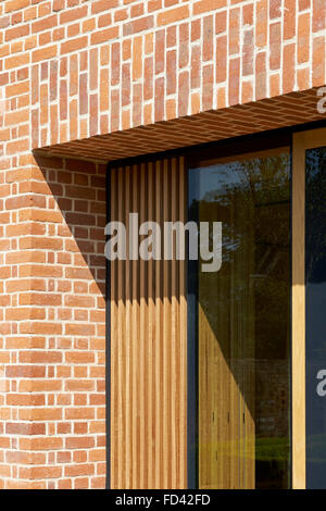 Red brick and timber cladding exterior details at the rear of the Stock ...