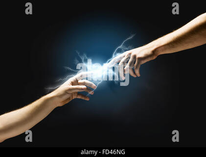 Michelangelo God's touch. Close up of human hands touching with fingers ...