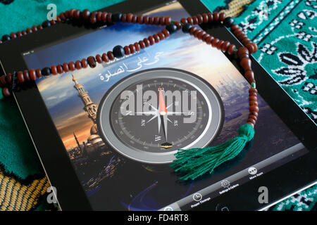 Islamic compass on an Ipad. Qibla compass used by Muslims to indicate ...