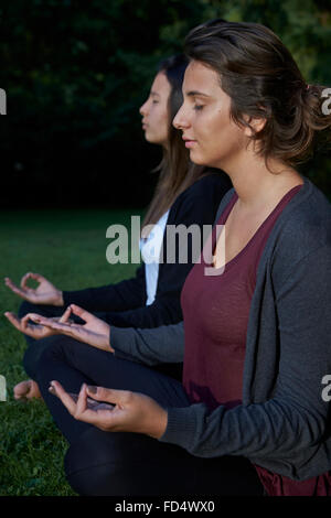 Teenagers practising meditation Stock Photo - Alamy