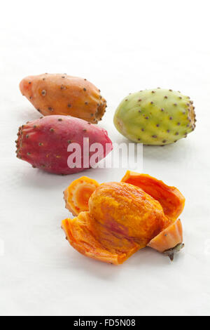 Whole fresh prickly pear fruit in a plate and cut in half an opuntia on ...