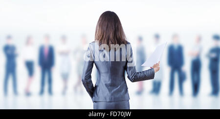 Back view of businesswoman holding papers in hands Stock Photo - Alamy