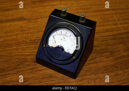 Analogue electricity meter with dials, old electric meter reading in a ...