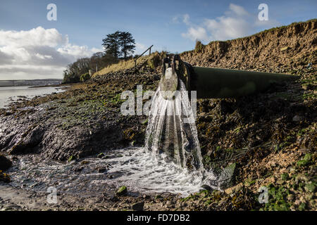 Waste water flows out of an outflow waste water pipe into the river in ...