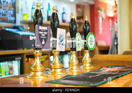 Beer handpumps in the interior of a traditional English pub Stock Photo ...