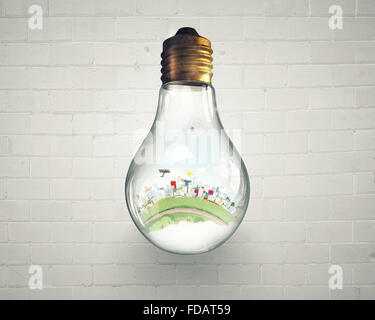Think green concept with cityscape inside of light bulb Stock Photo - Alamy