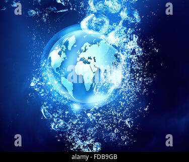 Digital planet sink in clear blue water Stock Photo - Alamy