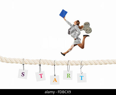 Young businesswoman walking with wind up key in his back Stock Photo ...