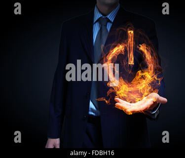 Glowing fire power icon of interface on dark background Stock Photo - Alamy