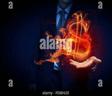 Burning dollar sign in businessman palm on dark background Stock Photo ...
