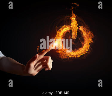 Glowing fire power icon of interface on dark background Stock Photo - Alamy