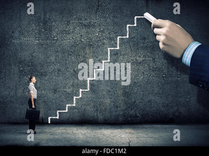 Businesswoman stepping ladder drawn by hand with chalk Stock Photo - Alamy