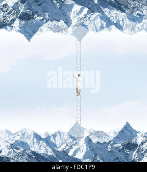 Businesswoman standing on ladder between two realities Stock Photo - Alamy