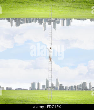Businesswoman standing on ladder between two realities Stock Photo - Alamy