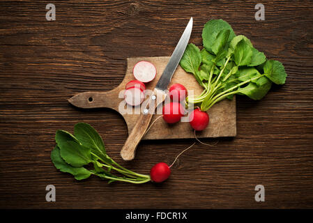 Fresh red radish on wooden background Stock Photo - Alamy