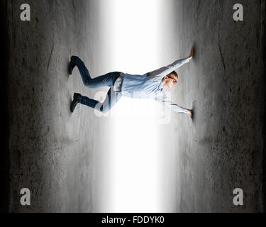 Young troubled businessman trapped between two walls Stock Photo - Alamy