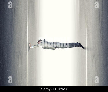 Young troubled businessman trapped between two walls Stock Photo - Alamy