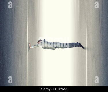 Young troubled businessman trapped between two walls Stock Photo - Alamy