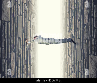 Young man trapped between walls Stock Photo - Alamy