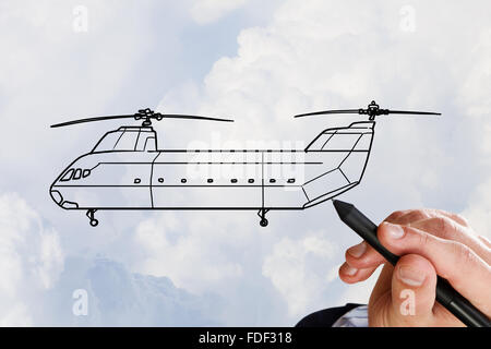 Person hand drawing helicopter model ob sky background Stock Photo - Alamy