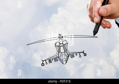 Person hand drawing helicopter model ob sky background Stock Photo - Alamy