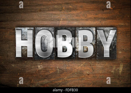 The word "HOBBY" written in vintage dirty metal letterpress type on a ...